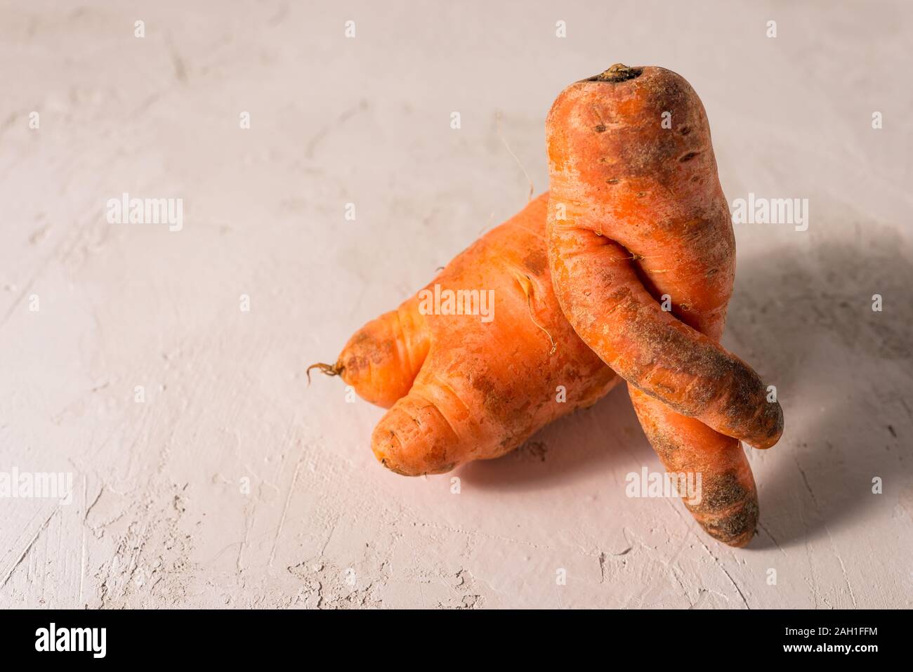 ugly vegetables, carrots on a light background.funny monster carrot The ...