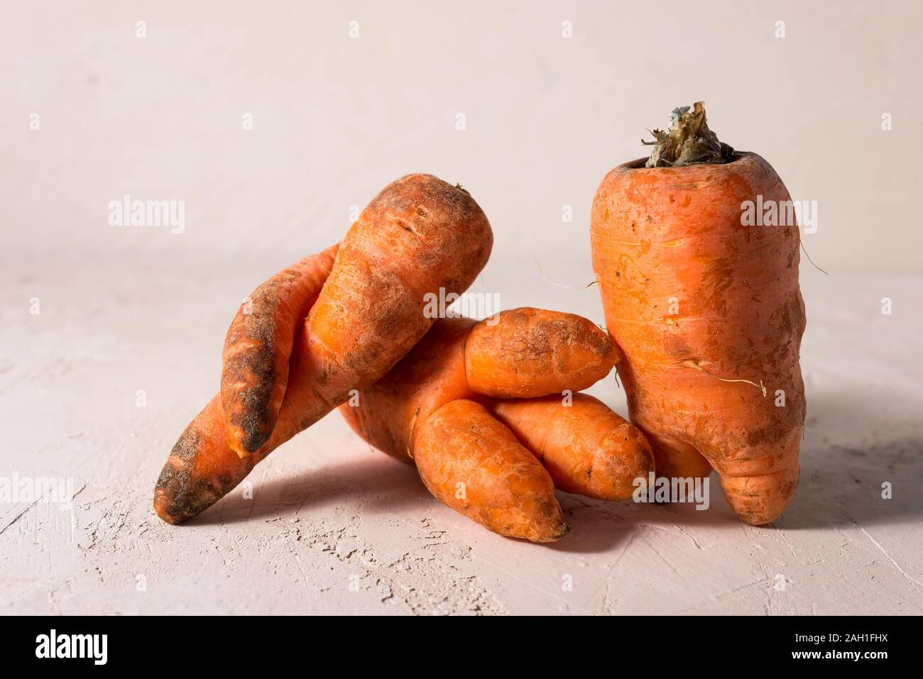 ugly vegetables, carrots on a light background.funny monster carrot The ...