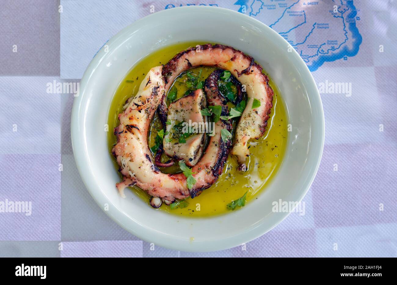 Greece, plate with grilled squid Stock Photo - Alamy