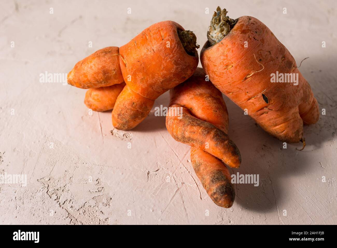 ugly vegetables, carrots on a light background.funny monster carrot The ...