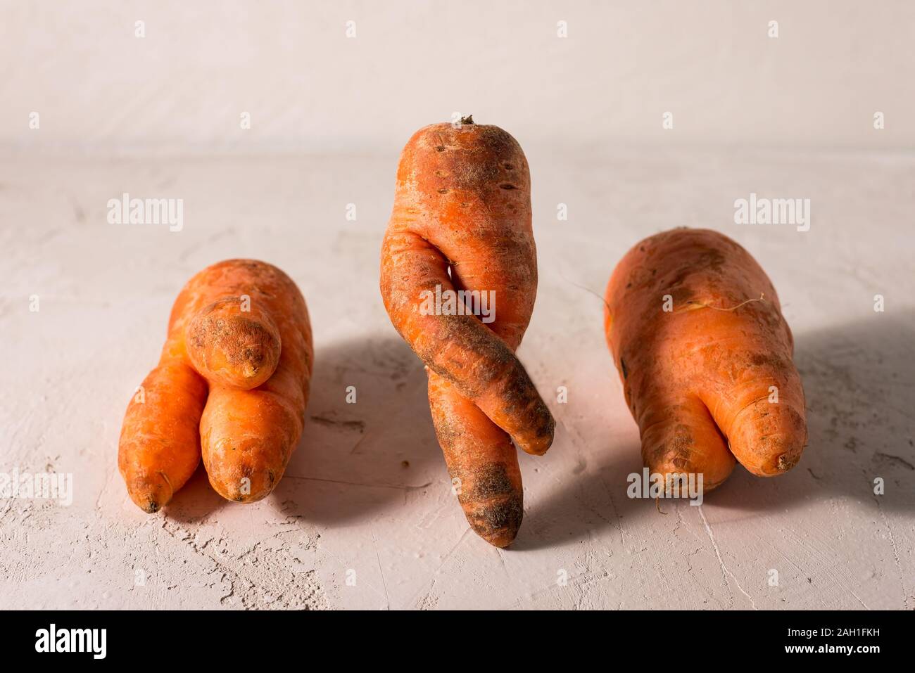 ugly vegetables, carrots on a light background.funny monster carrot The ...