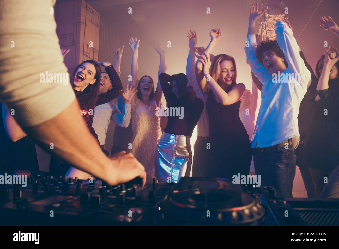 Portrait of crazy students having prom moving dj using technology ...