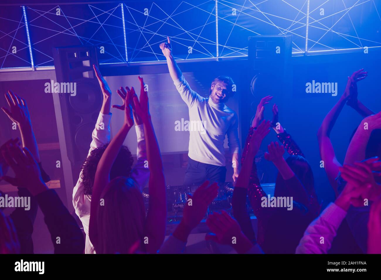 Portait of cheerful dj raise hands scream shout people wear shirt disco ...