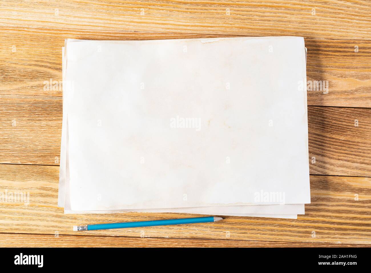 Sheet of paper lying on wooden table. Scrapbooking and hand made ...