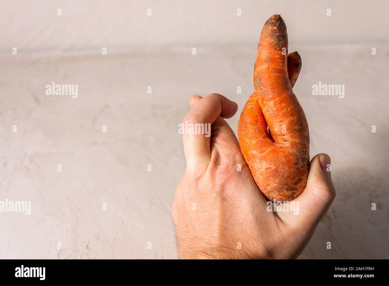 ugly vegetables, carrots on a light background.funny monster carrot The ...