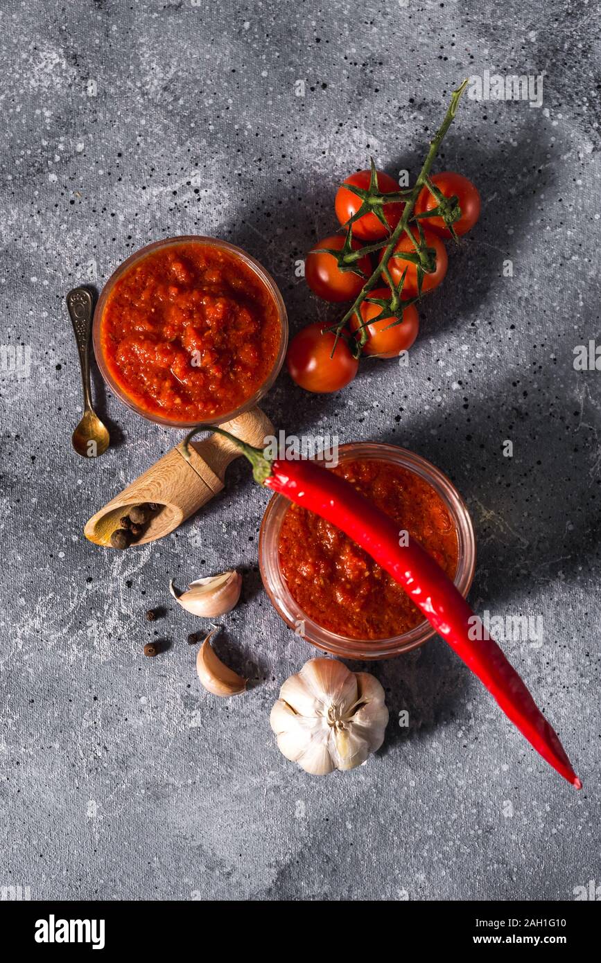 Traditional mexican, georgian and arabic harissa pepper paste on a gray ...