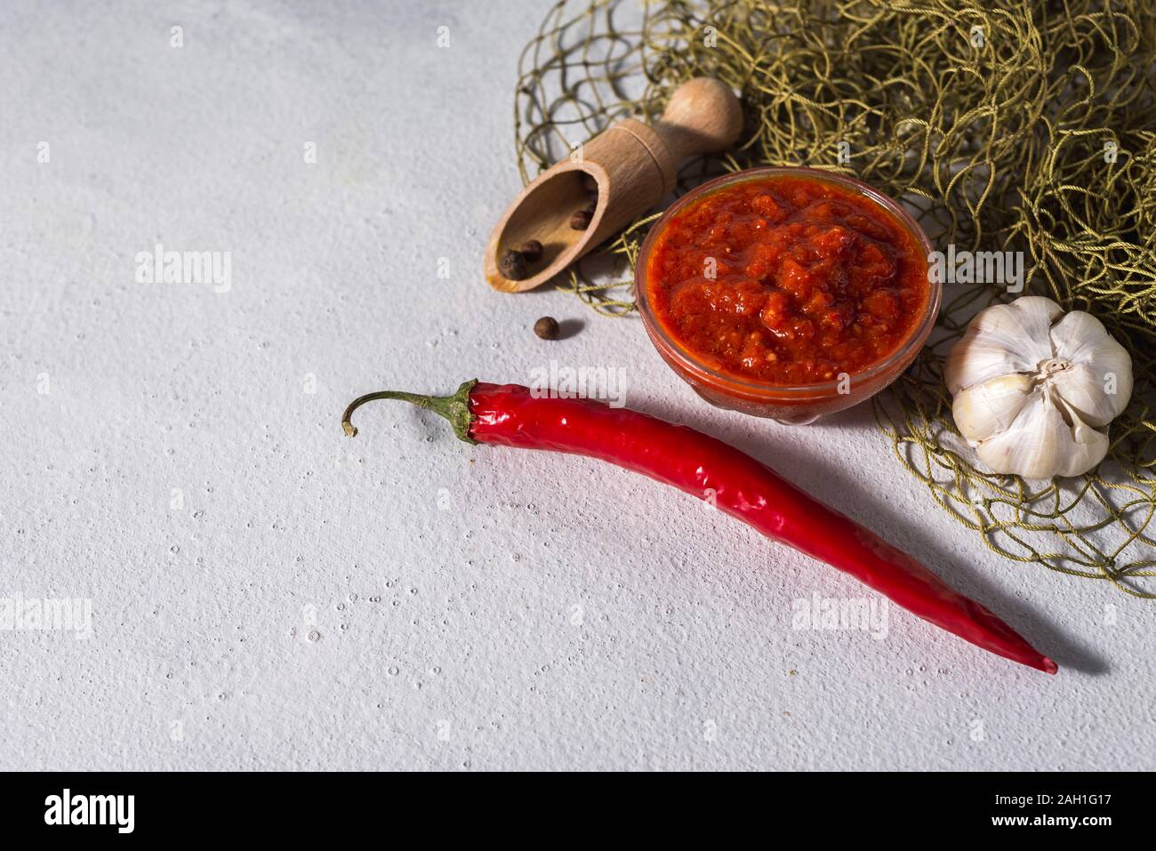 Traditional mexican, georgian and arabic harissa pepper paste on a gray ...
