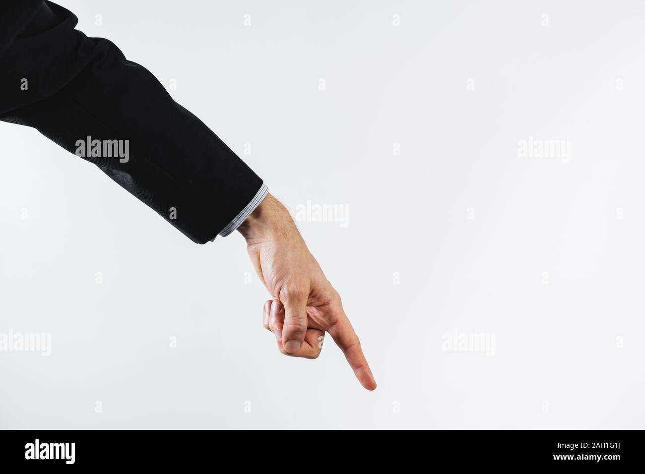 Business concept: hand pointing down. Symbol of going down, recession ...