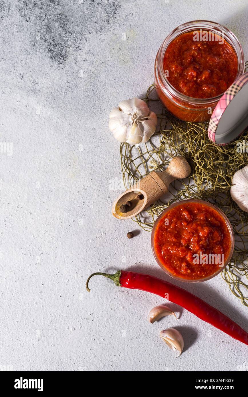 Traditional mexican, georgian and arabic harissa pepper paste on a gray ...
