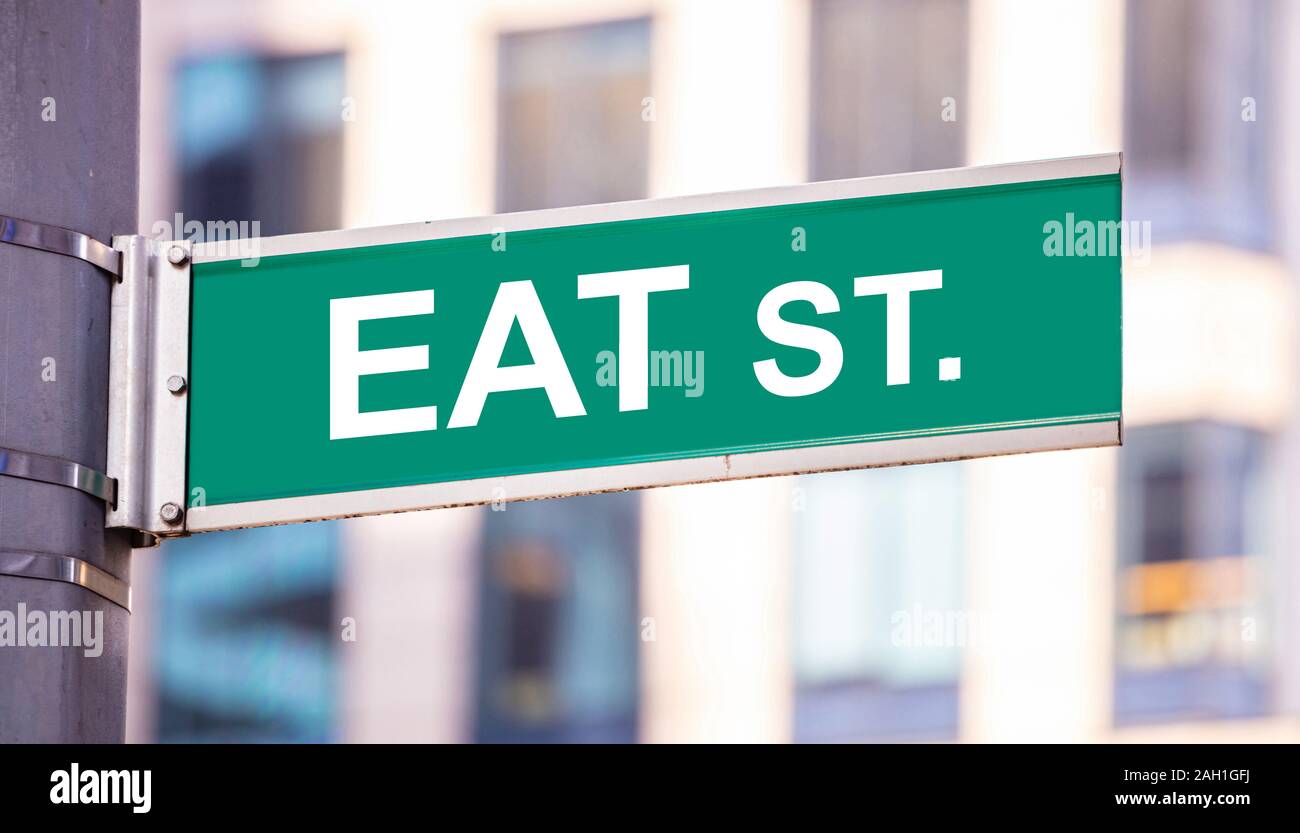 Eat street sign, street food concept, green color, city center downtown ...