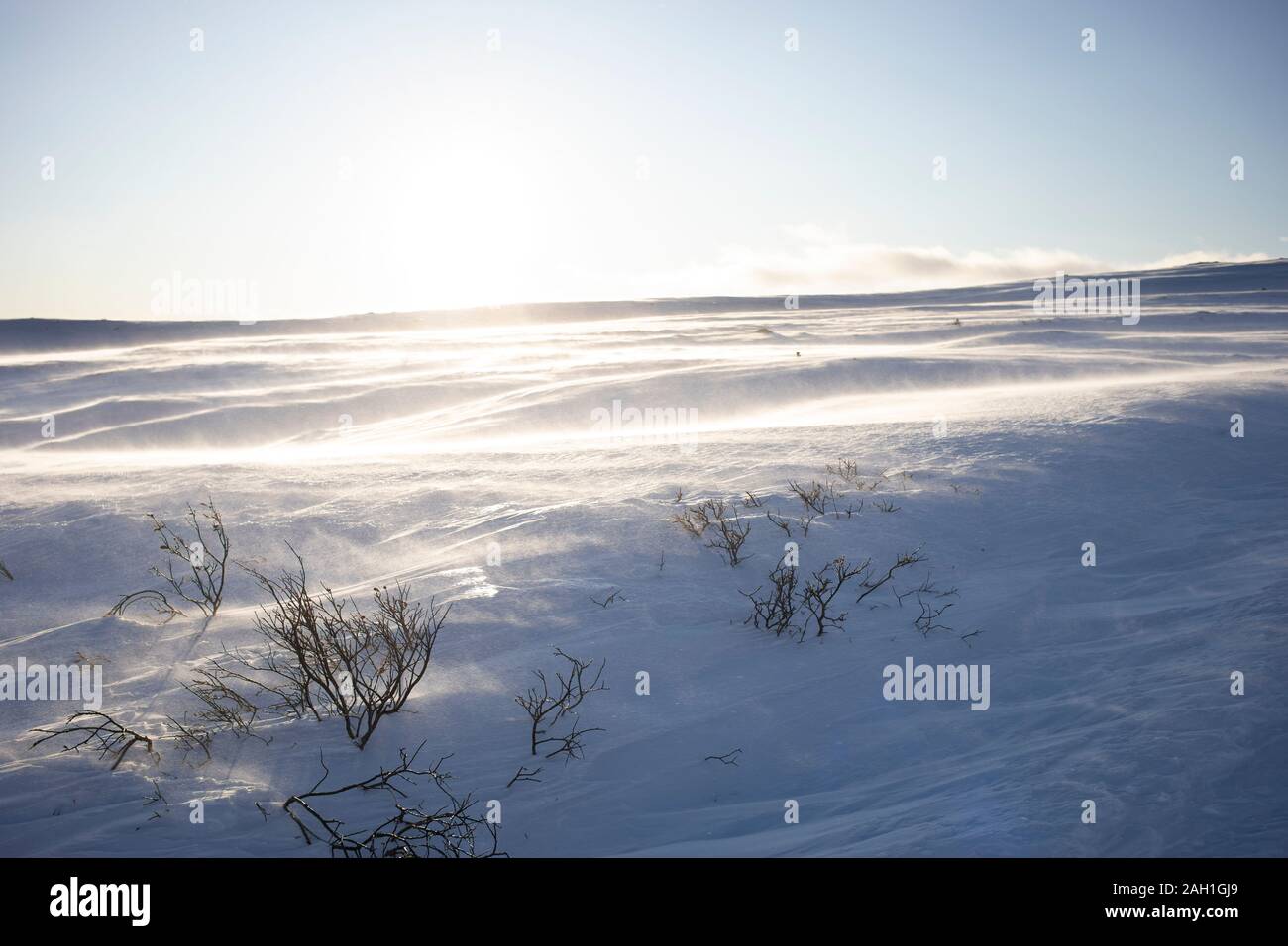 The sun and the snow mountains in winter hi-res stock photography and ...
