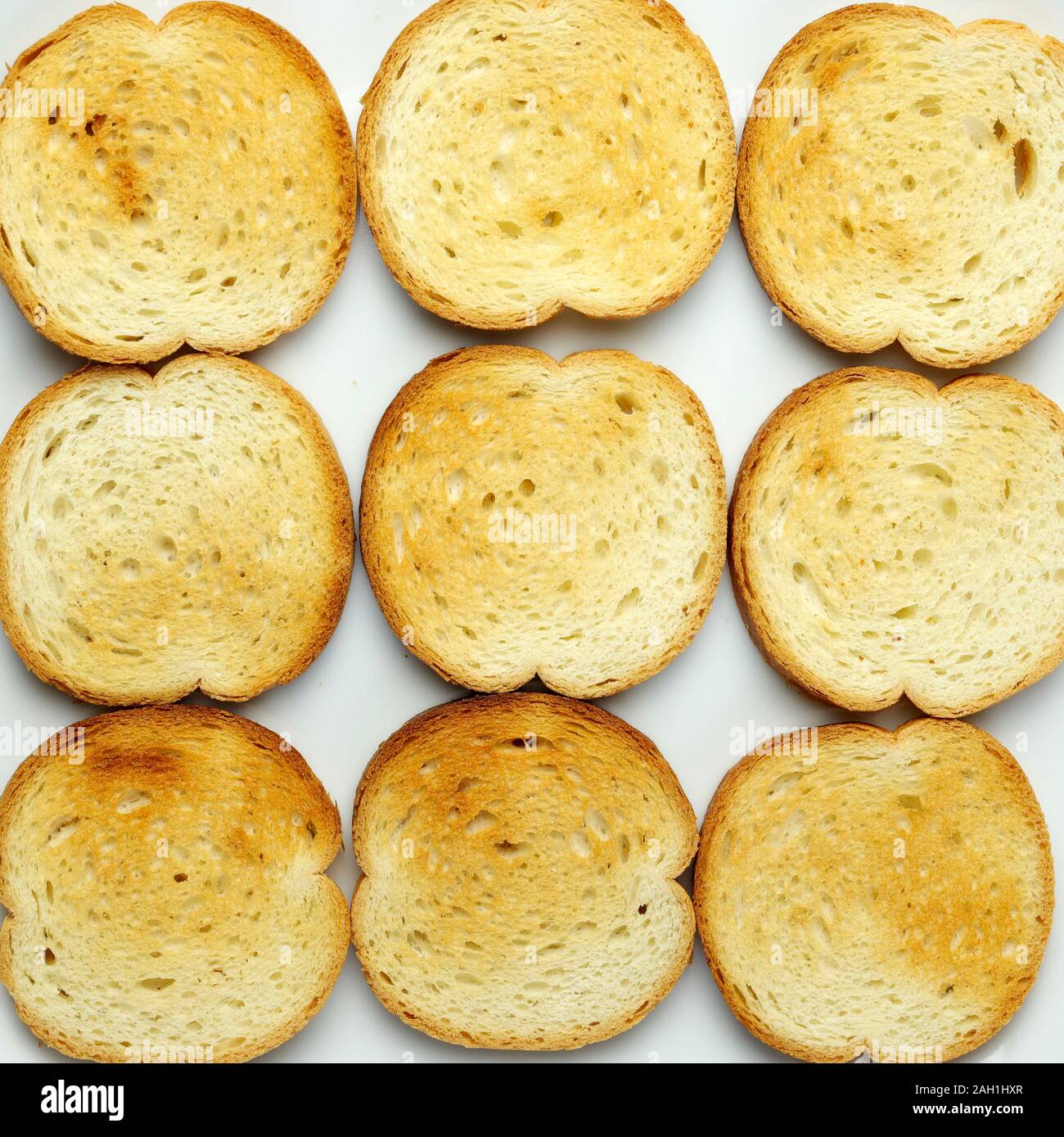 Toasted bread on white background. Directly above Stock Photo - Alamy
