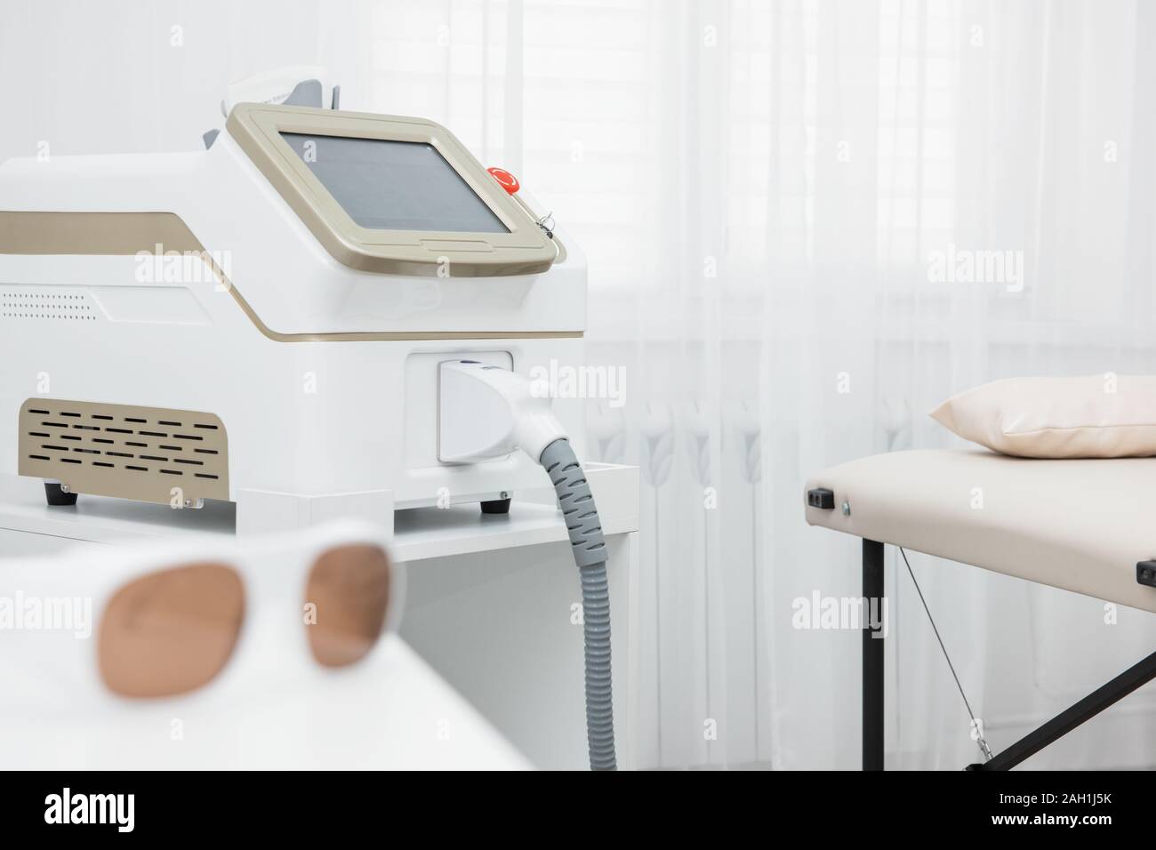 Room in spa center with laser epilation equipment Stock Photo - Alamy