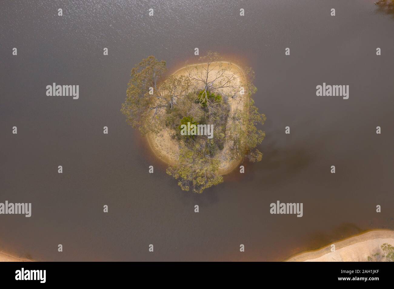 Aerial photograph of mini island in a drought affected water reservoir ...