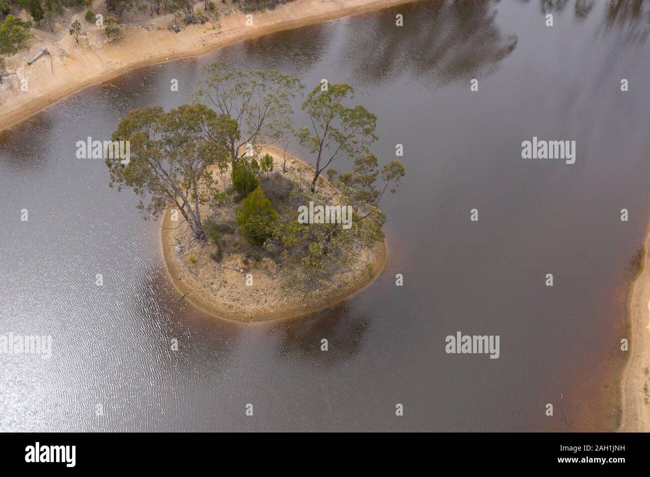 Aerial photograph of mini island in a drought affected water reservoir ...