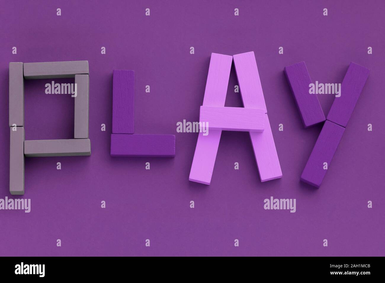 Word PLAY Made From Wooden Bricks Toys On Violet Background Kids Game word-play-made-from-wooden-bricks-toys-on-violet-background-kids-game