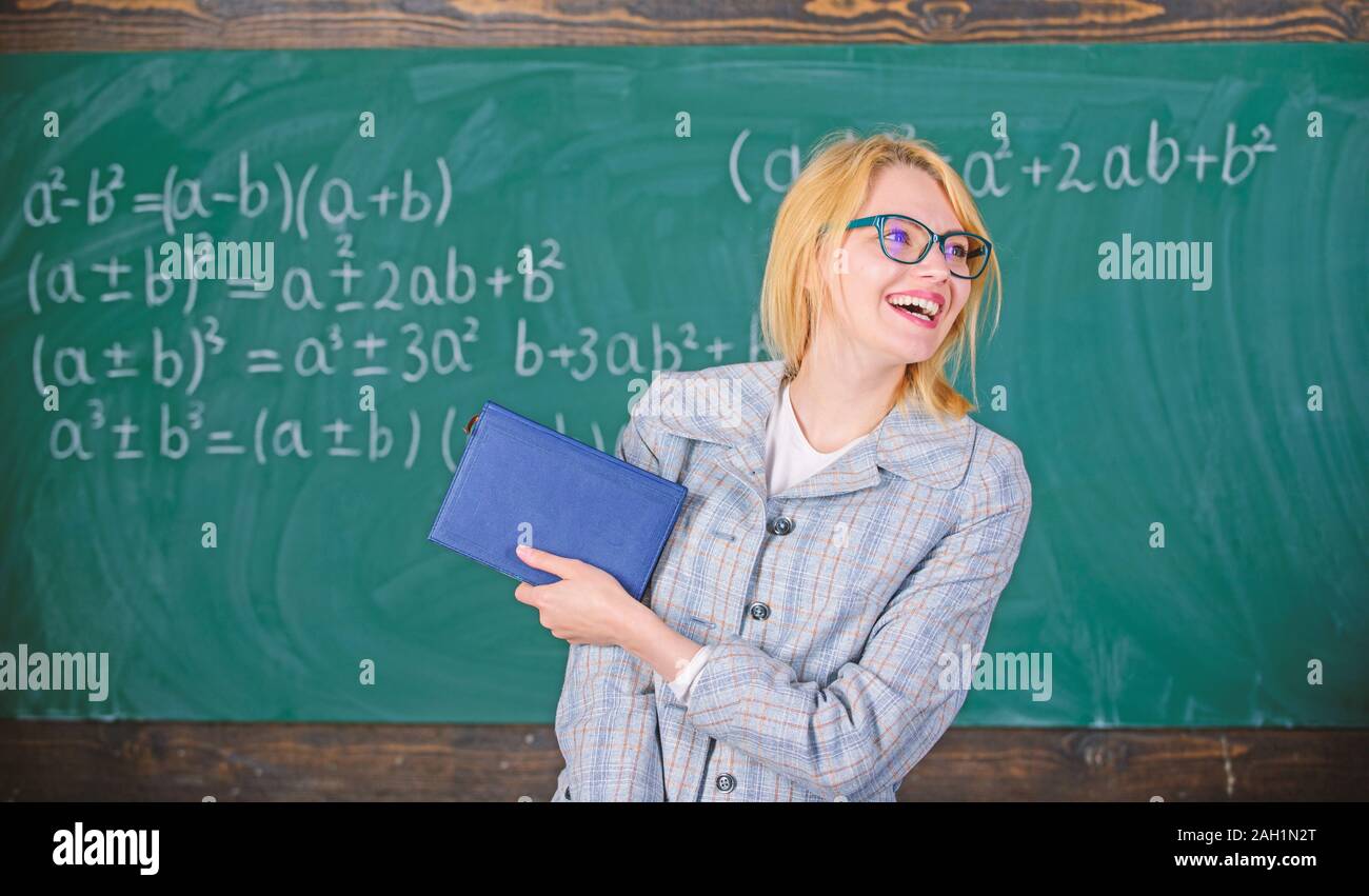 Woman smiling teacher hold book stand front chalkboard. Recommendation ...