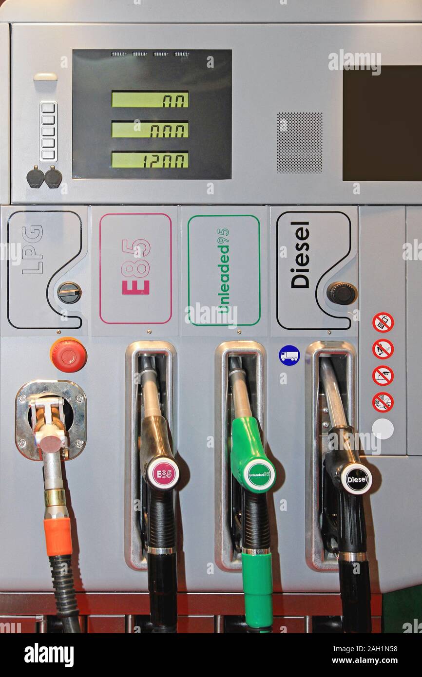 Fuel Dispenser With Four Nozzles at Petrol Station Stock Photo - Alamy