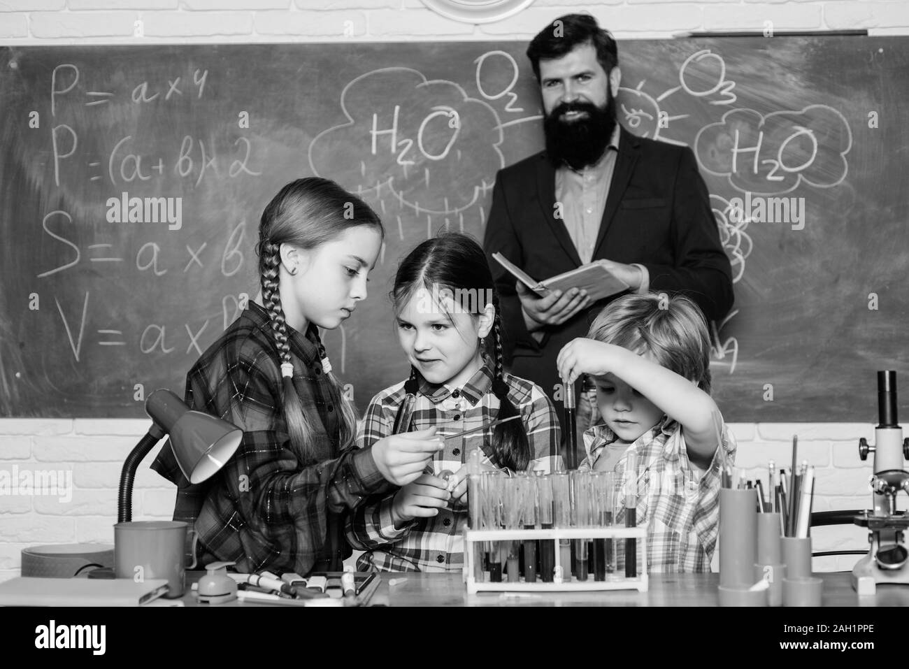 Medical team. doing experiments with liquids in chemistry lab ...