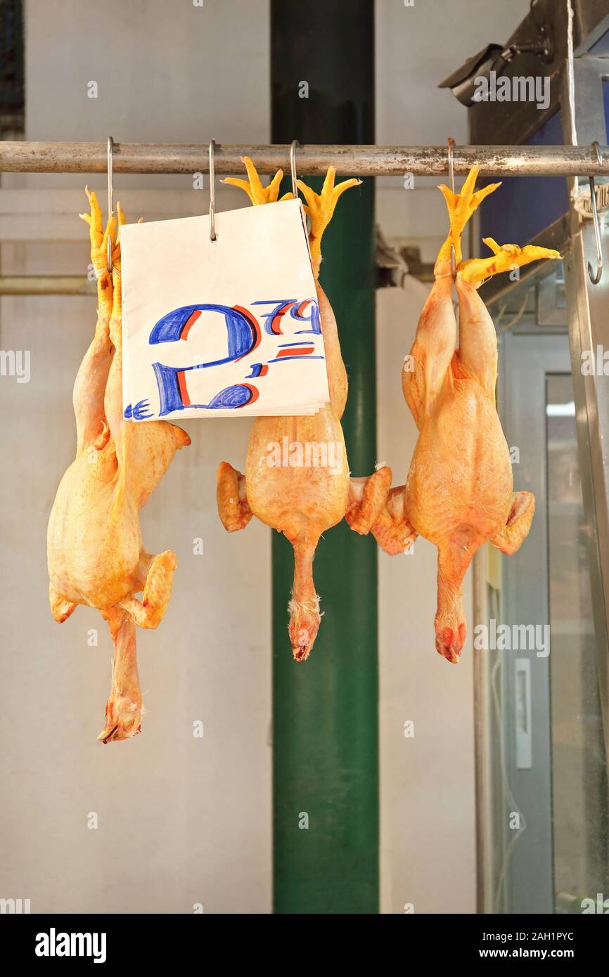 Roosters Poultry Hanging at Butcher Shop Stock Photo - Alamy