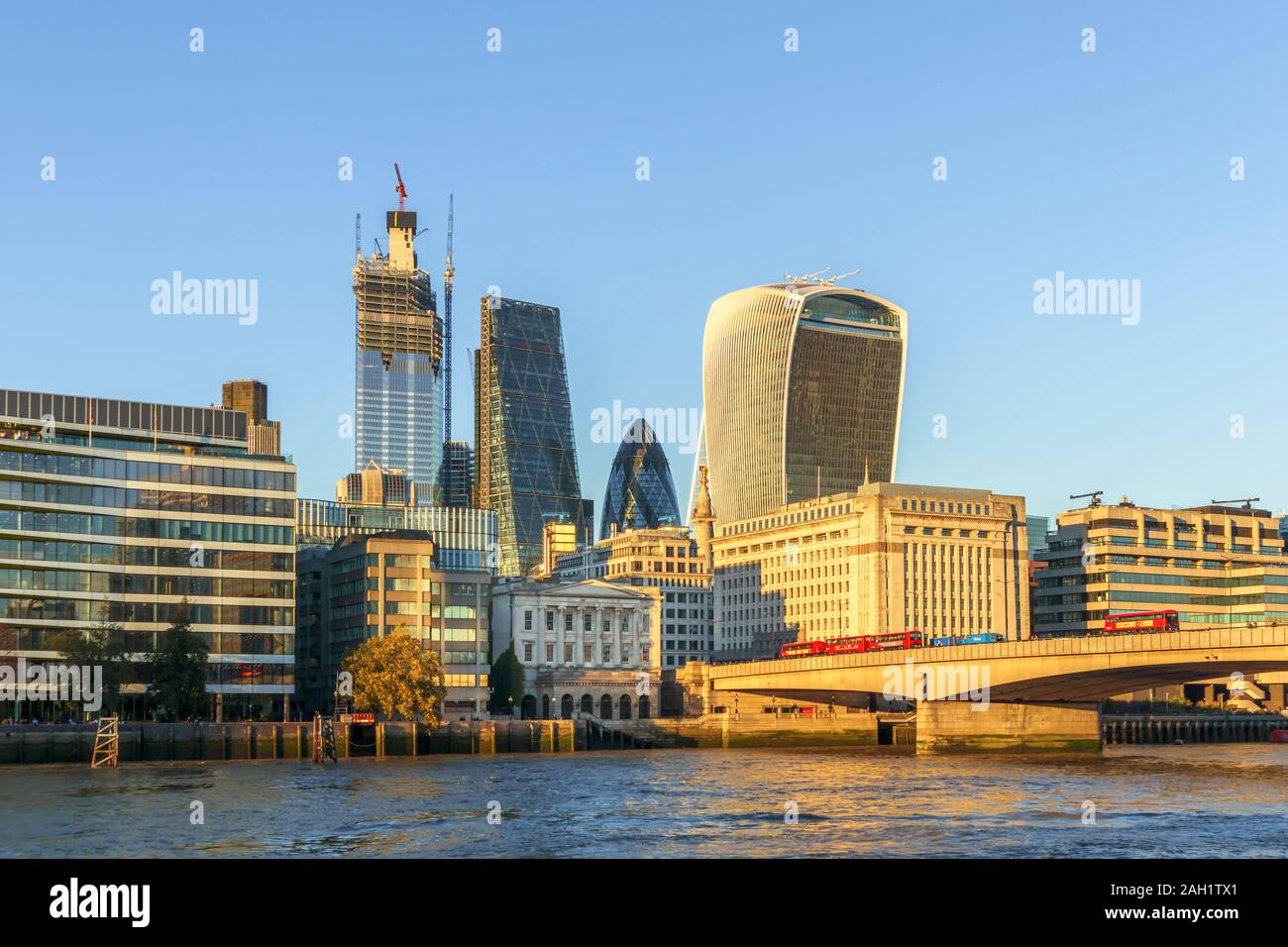 Golden hour view of the skyline of the City of London financial ...