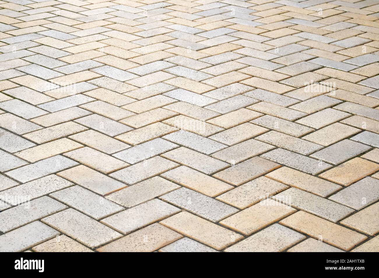 Yellow Paving slab, background. Pedestrian zone in the park in daylight ...