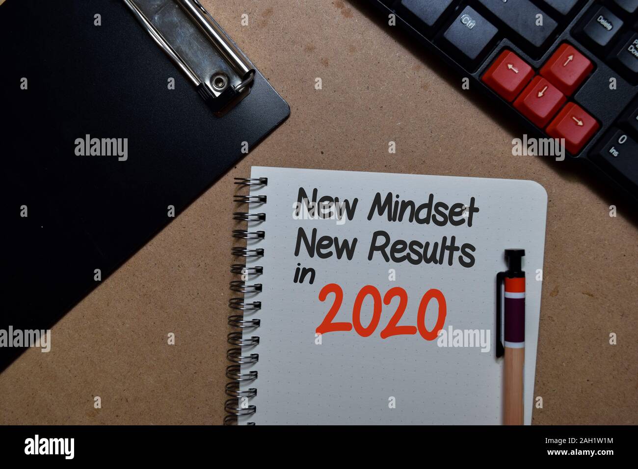 New Mindset, New Results in 2020 write on a book isolated on Office ...