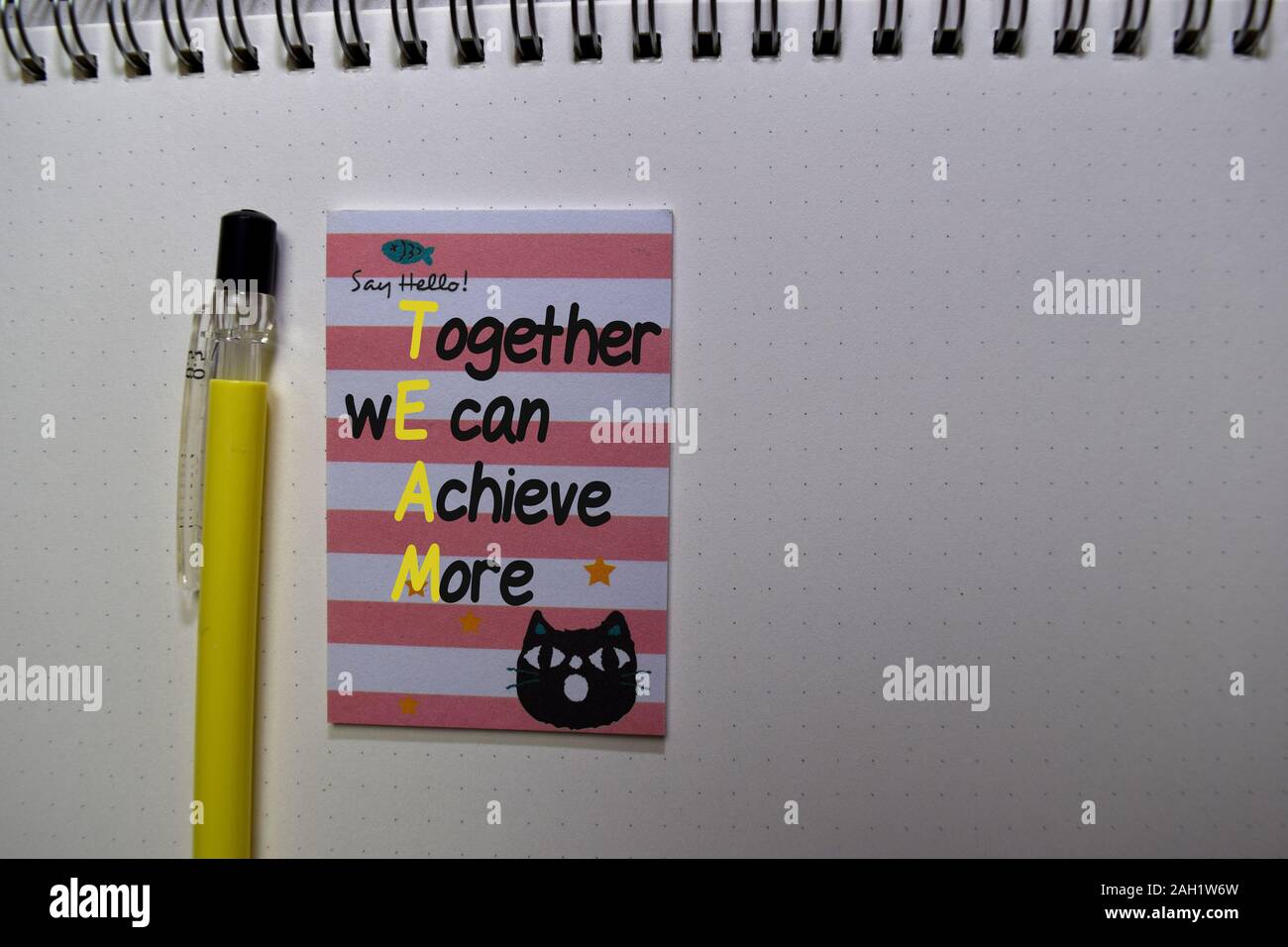 TEAM - Together wE can Achieve More write on sticky note isolated on ...