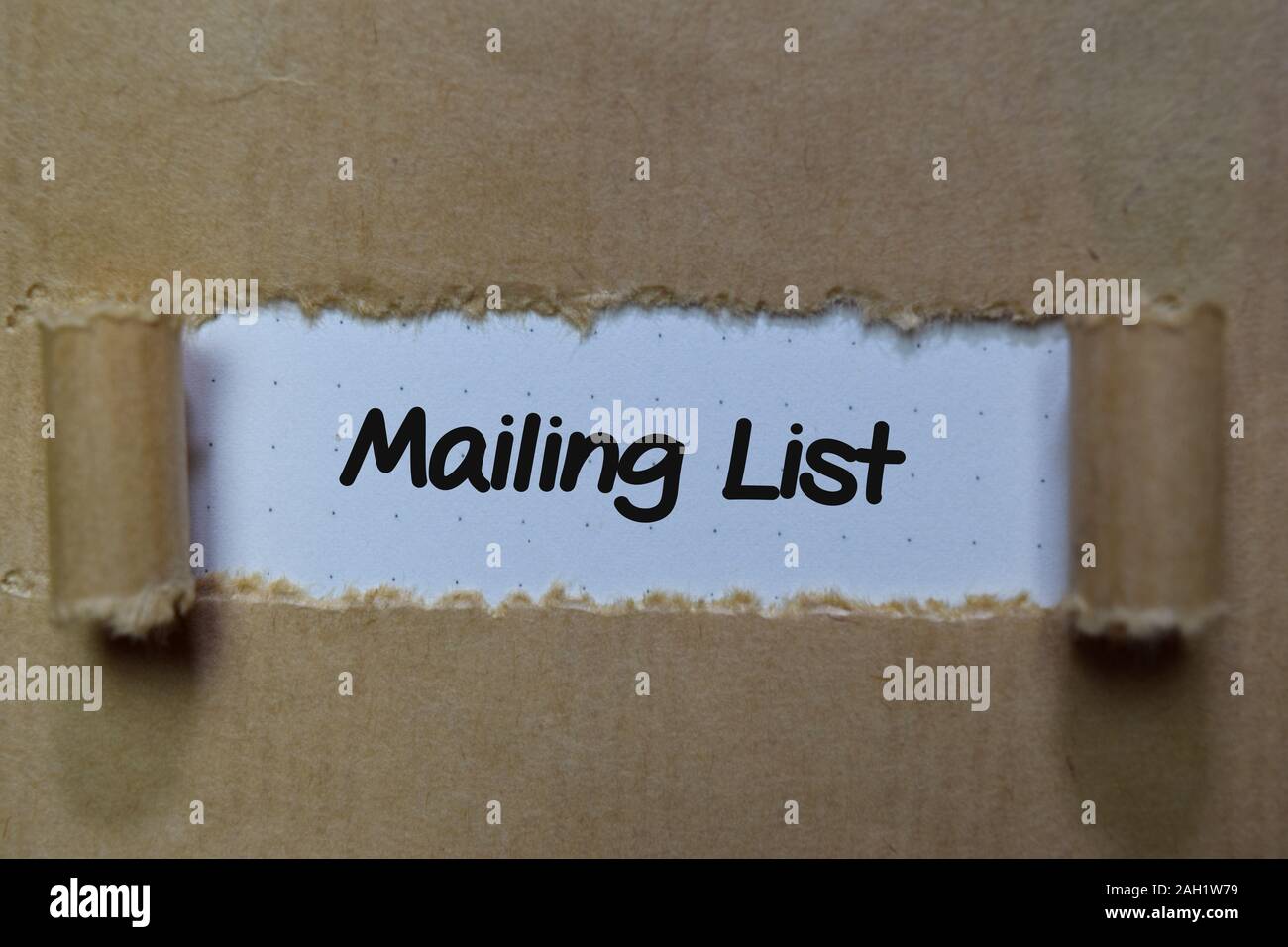 Mailing List write on white and brown torn paper Stock Photo - Alamy