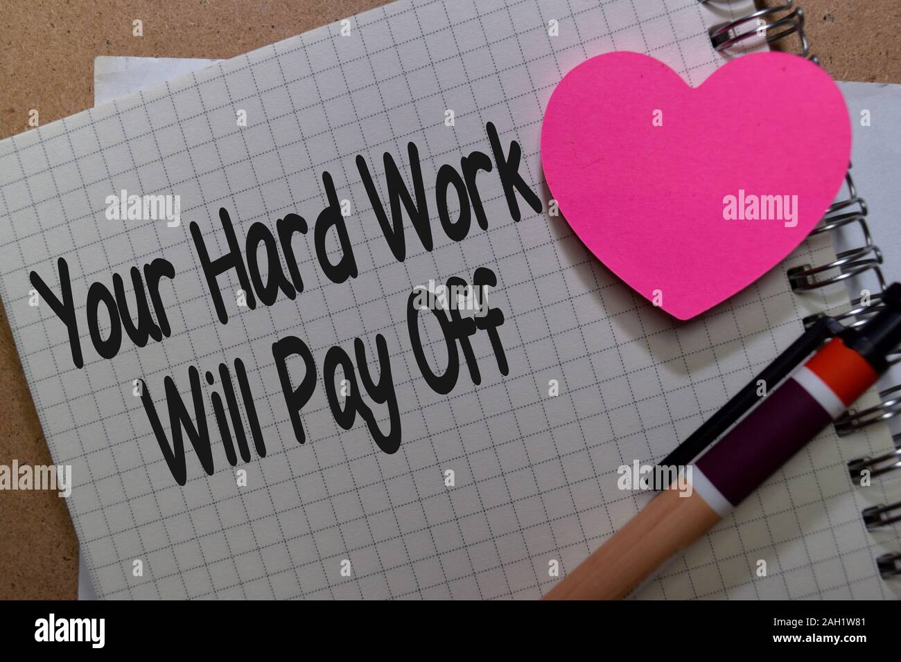 Your Hard Work Will Pay Off write on a book isolated on Office Desk ...