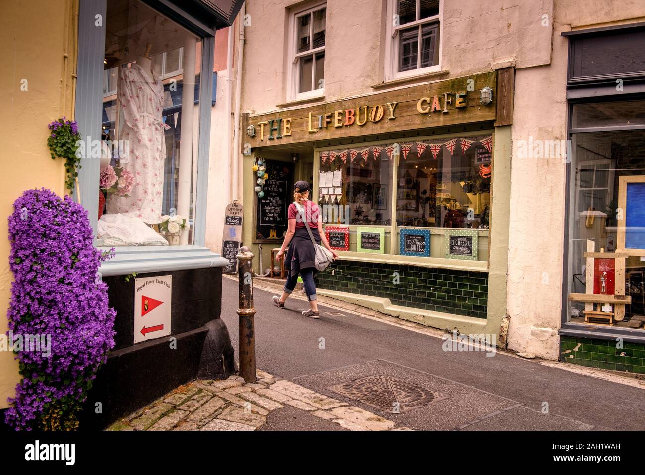 A person walks past The Lifebuoy cafe in Lostwithiel Street, Fowey ...