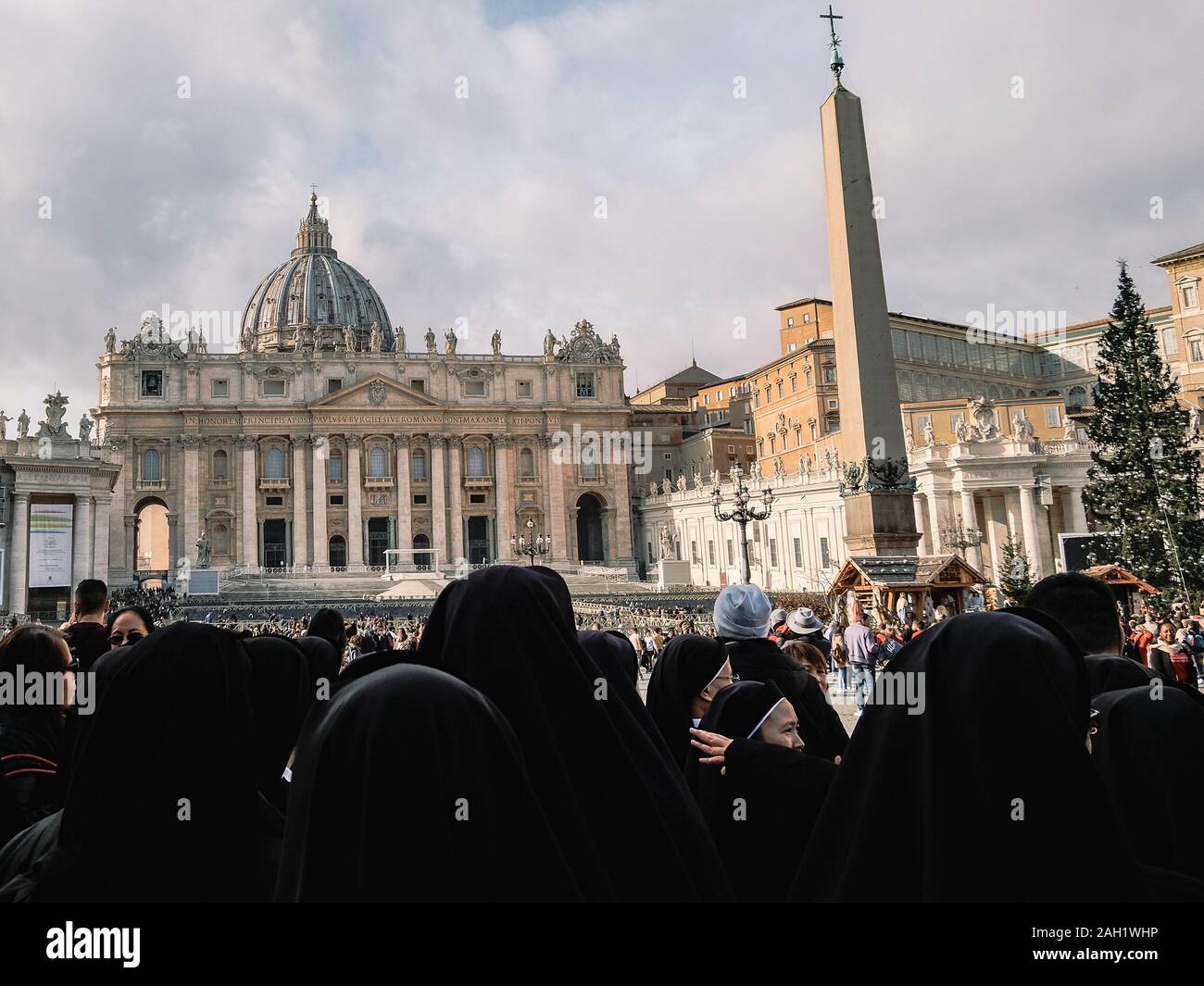 Pilgrims and nuns on rome vatican st peter's basilica square,christmas ...