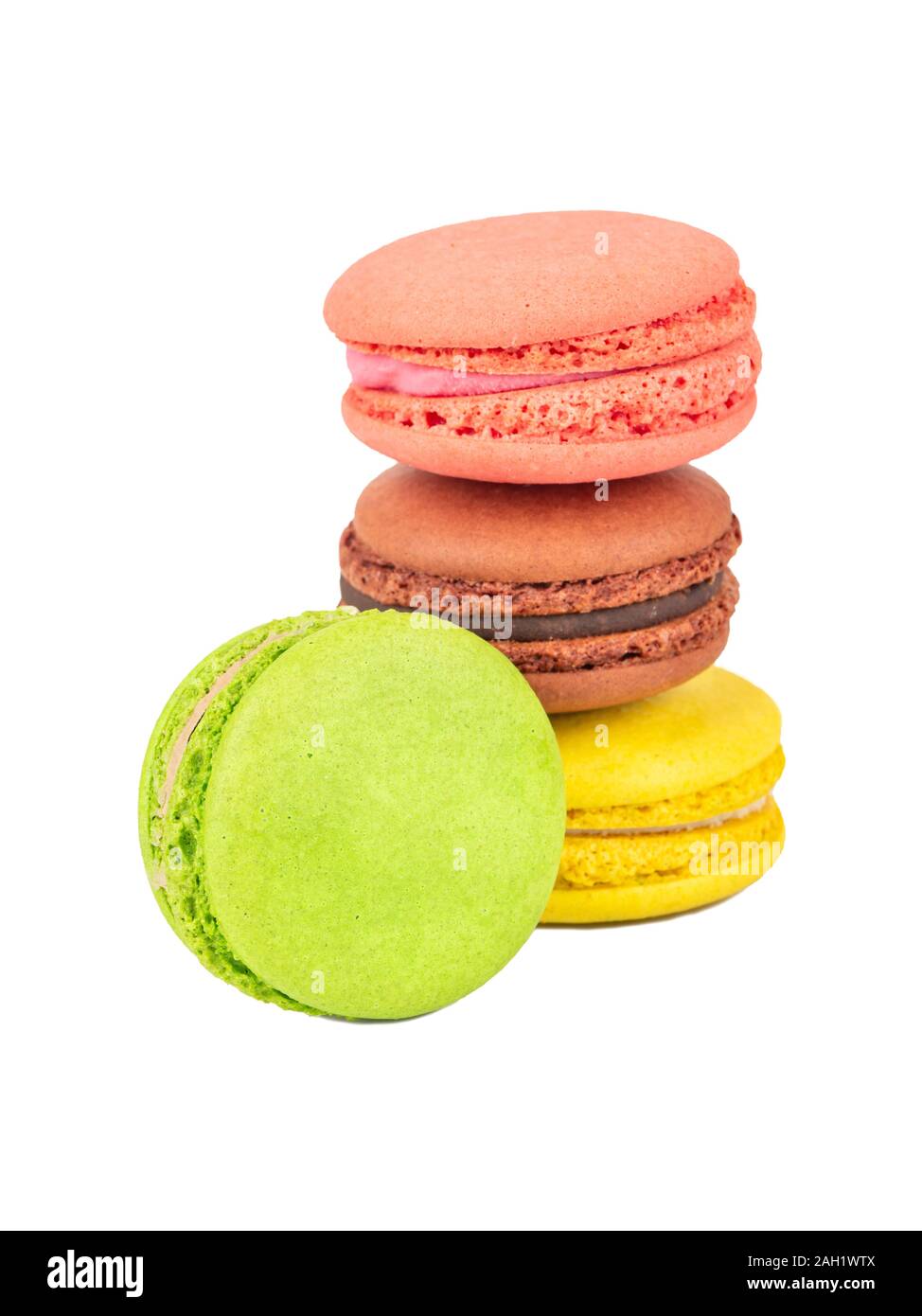 Four multicolored macaroons on a white background Stock Photo - Alamy