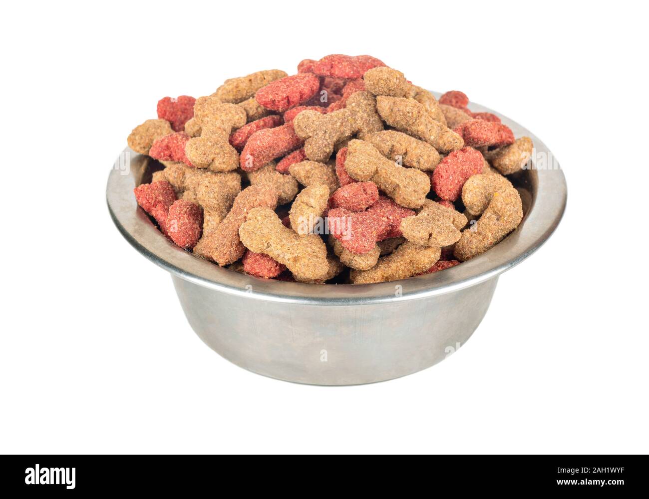 Dry dog food in the shape of a bone in an iron bowl on a white ...