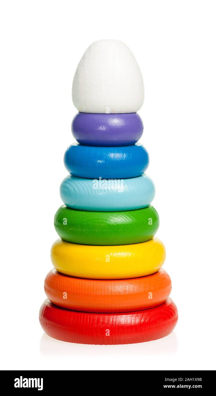 Colorful wooden pyramid toy on white background Stock Photo - Alamy