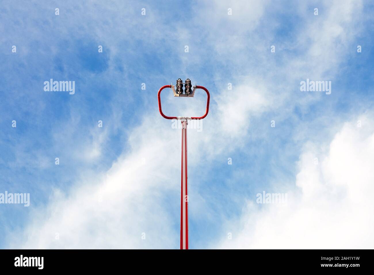 People ride on the extreme carousel on blue sky background Stock Photo ...