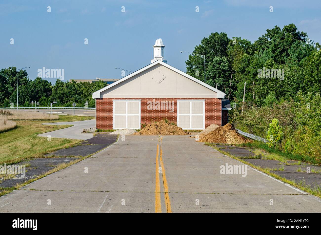 Highway service building in the middle of a road Stock Photo - Alamy