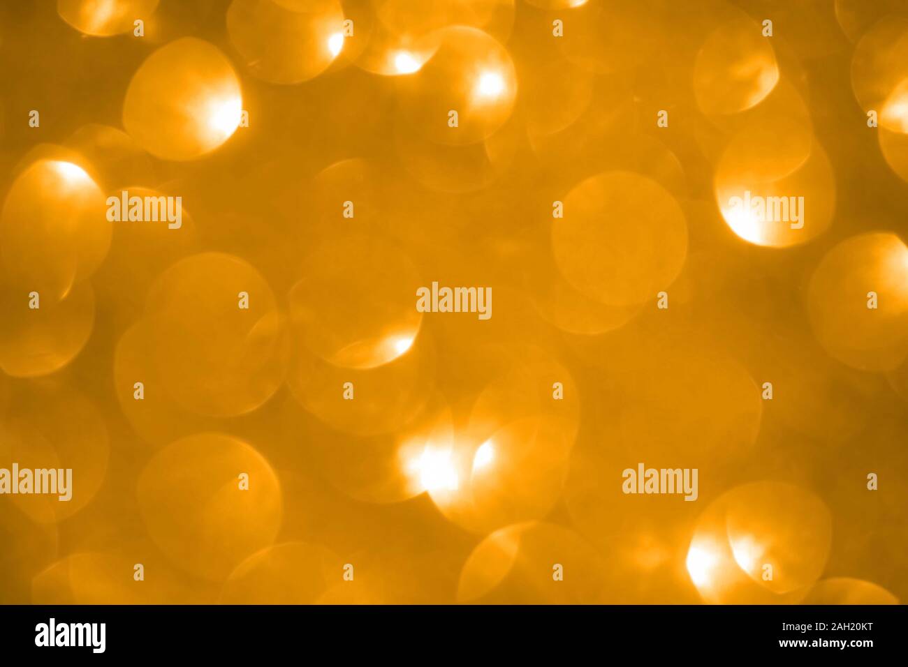 Abstract yellow saffron defocused bokeh glitter sparkle confetti burst ...