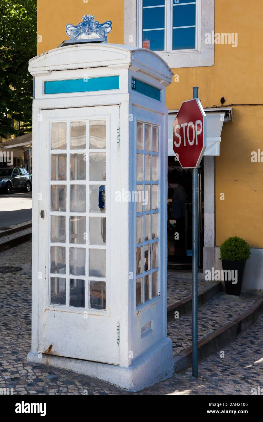 White vintage phone booth at a corner in Sintra Stock Photo - Alamy