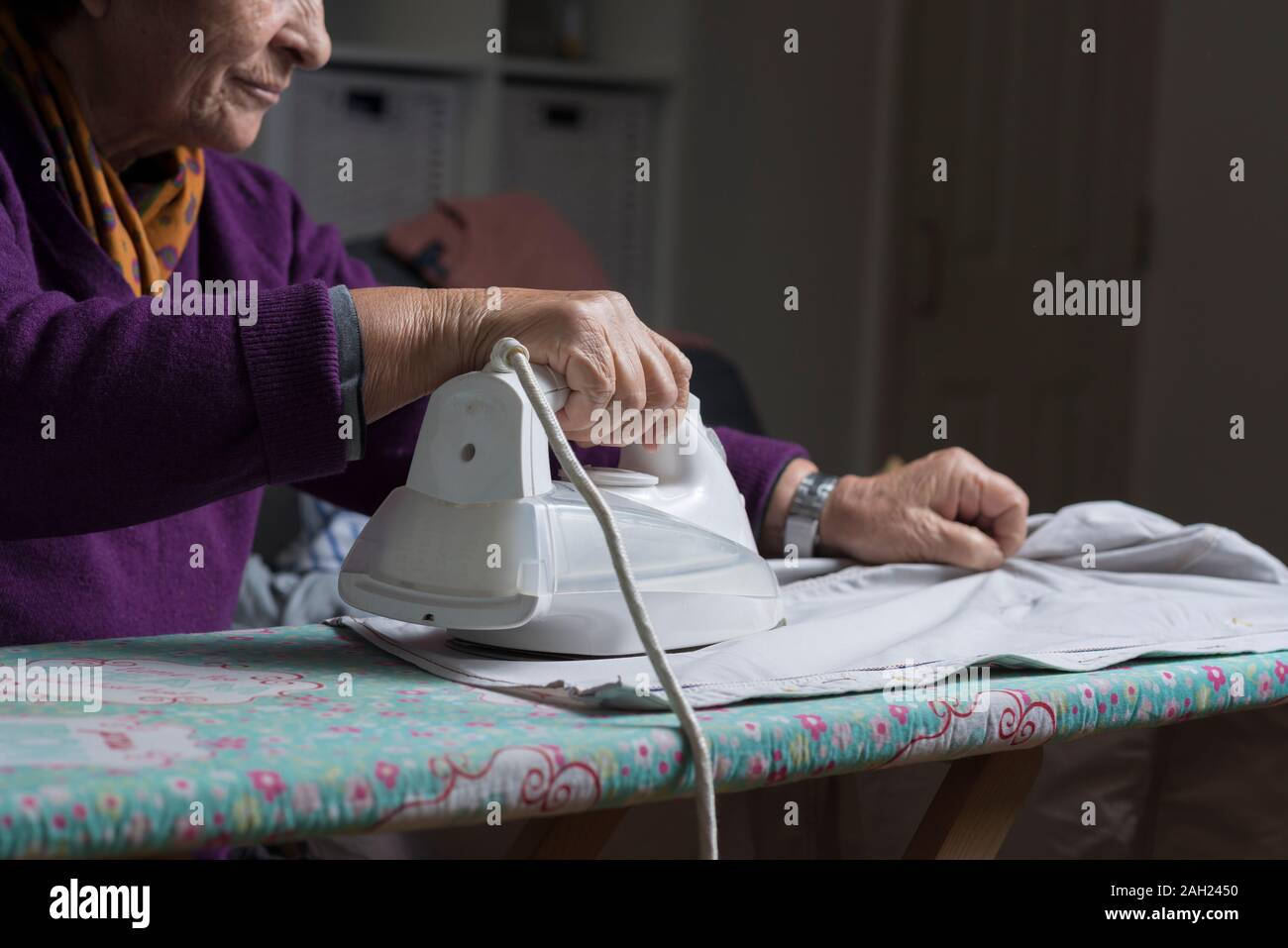 Older Lady ironing laundry Stock Photo - Alamy