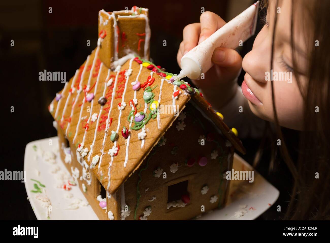Little Girl Building her Very First Gingerbread House Stock Photo - Alamy