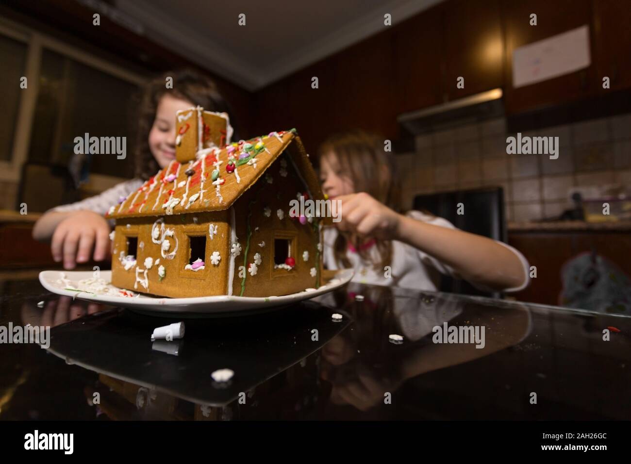 Children Building Their Very First Gingerbread House Stock Photo - Alamy