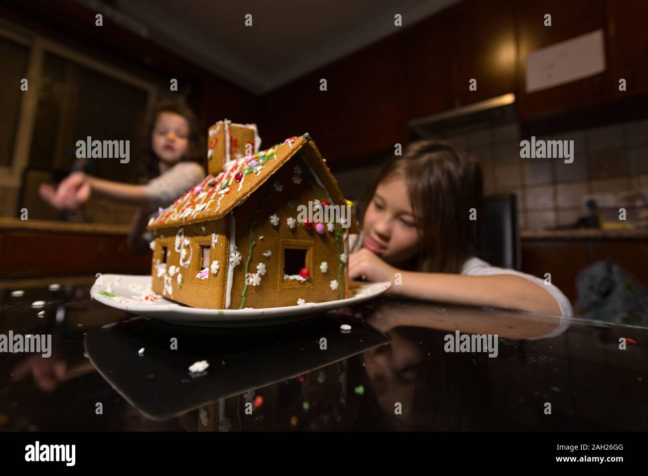 Children Building Their Very First Gingerbread House Stock Photo - Alamy