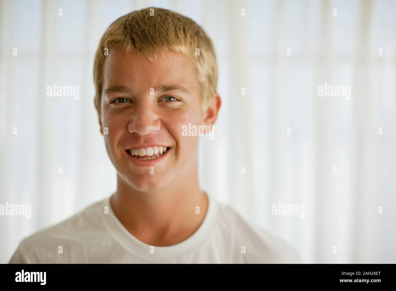 Portrait of a smiling teenage boy Stock Photo - Alamy