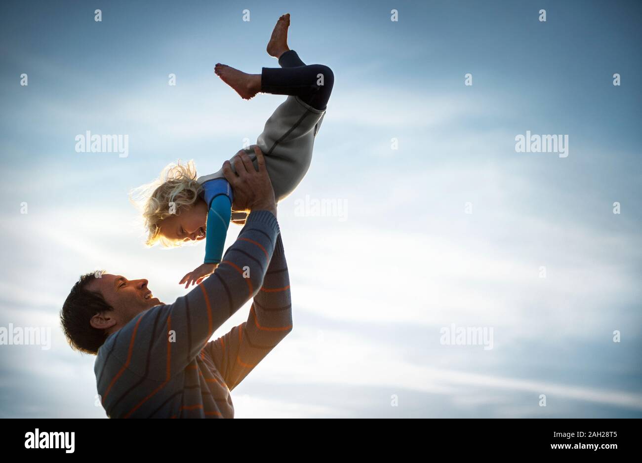 Child being lifted hi-res stock photography and images - Alamy