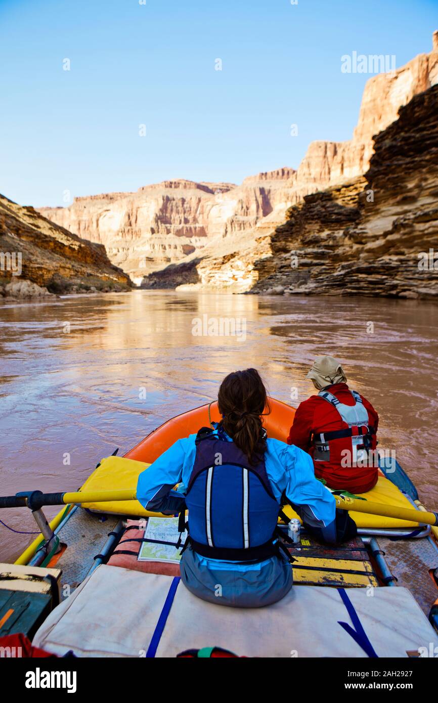 Two friends rafting down a river Stock Photo - Alamy