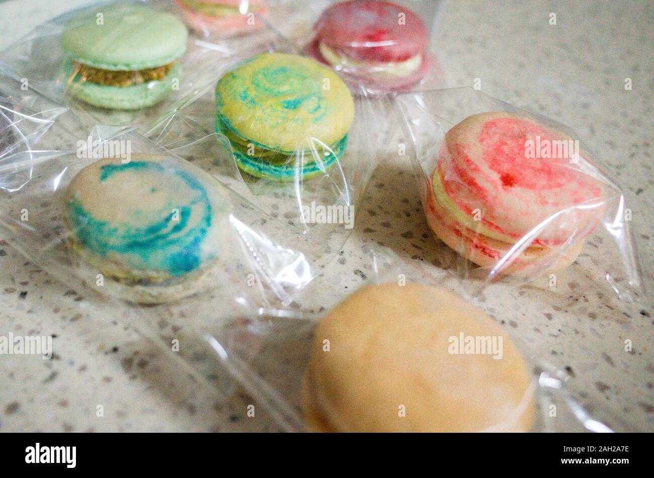 Macaroons of various colors are wrapped in plastic Stock Photo - Alamy