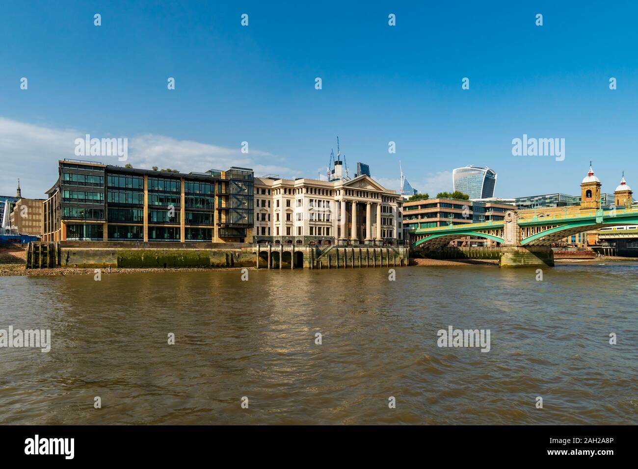 Southwark Bridge in London with some historic buildings, England, UK ...