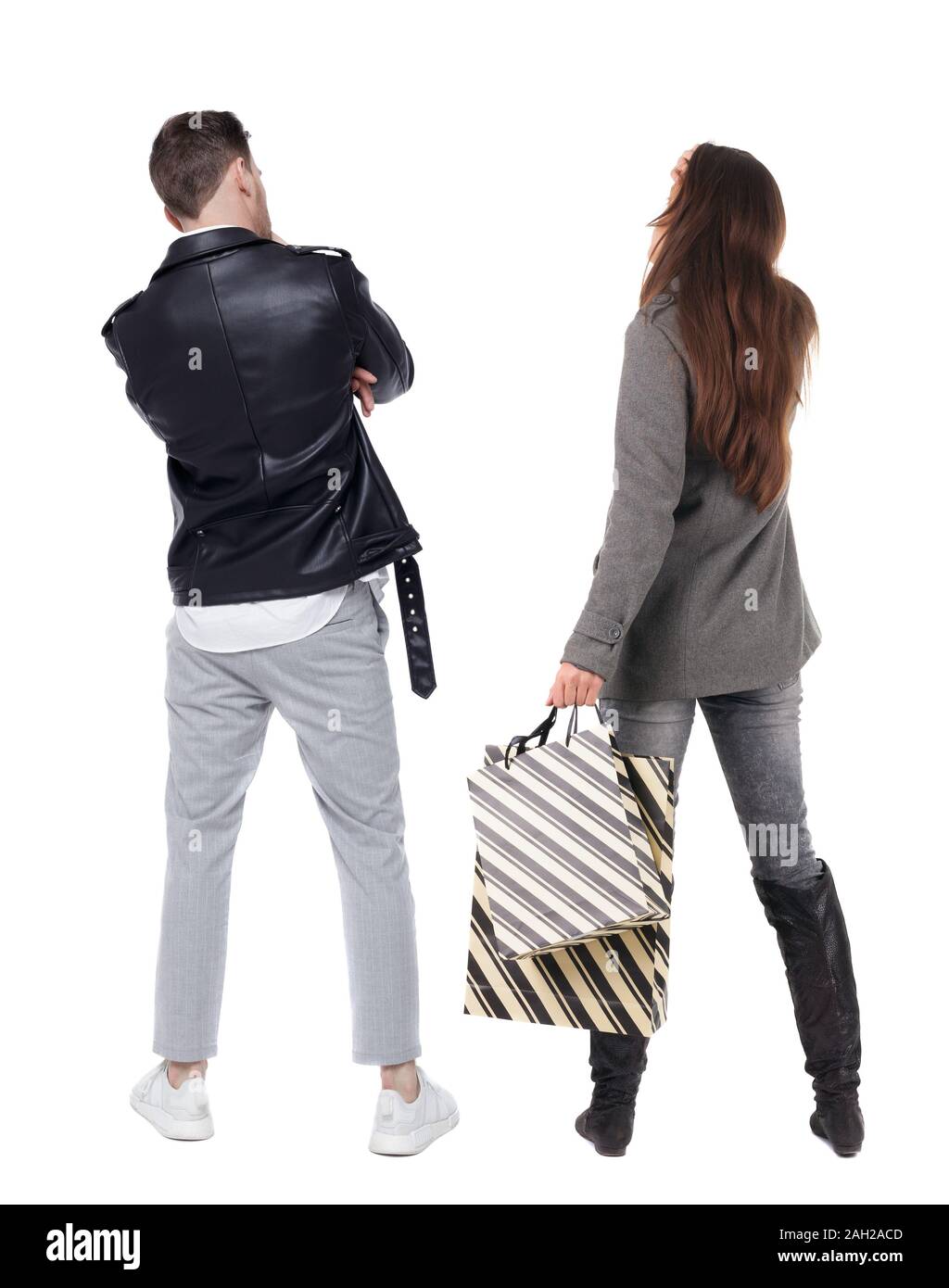 back view of couple with shopping bags. backside view of person. Rear ...