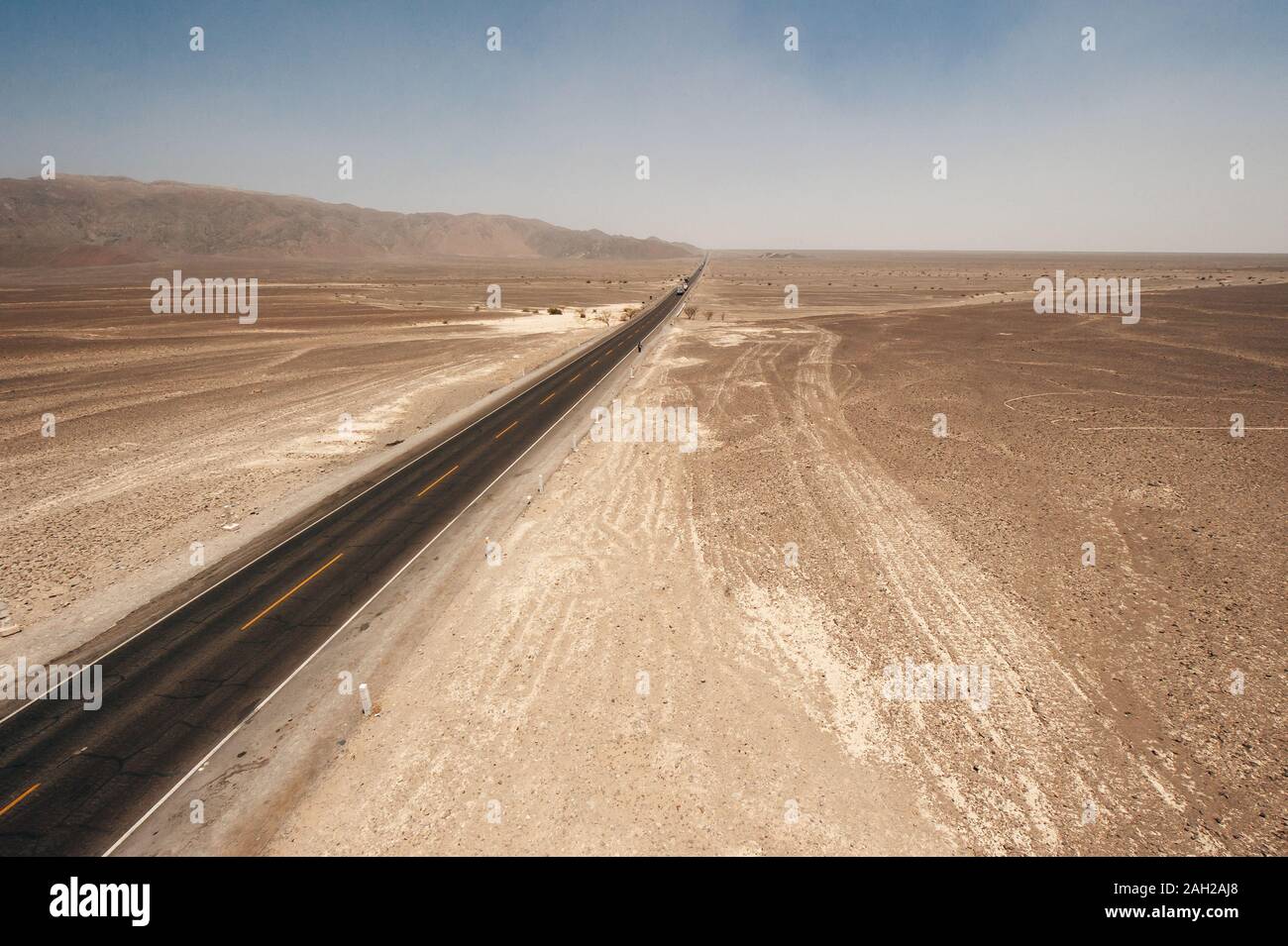 Highway cut through the famous Nazca lines Stock Photo - Alamy